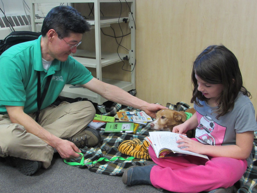 Free Library Focus: PAWS Program Brings Kids and Pups Together to ...
